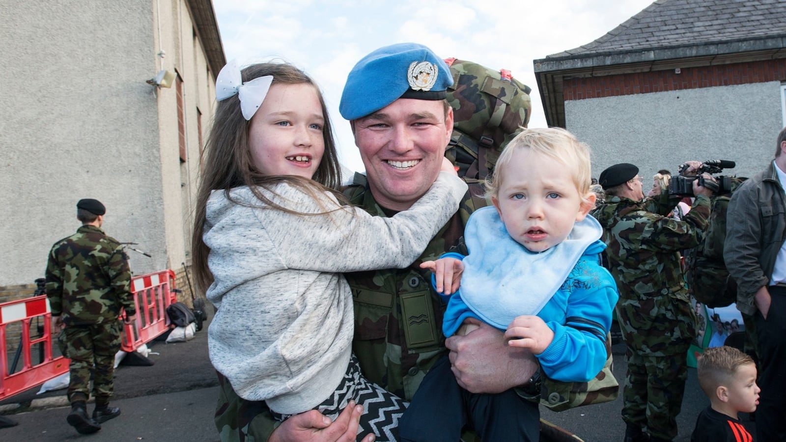 Troops surrounded by mob armed with posters and threatening hugs and ...